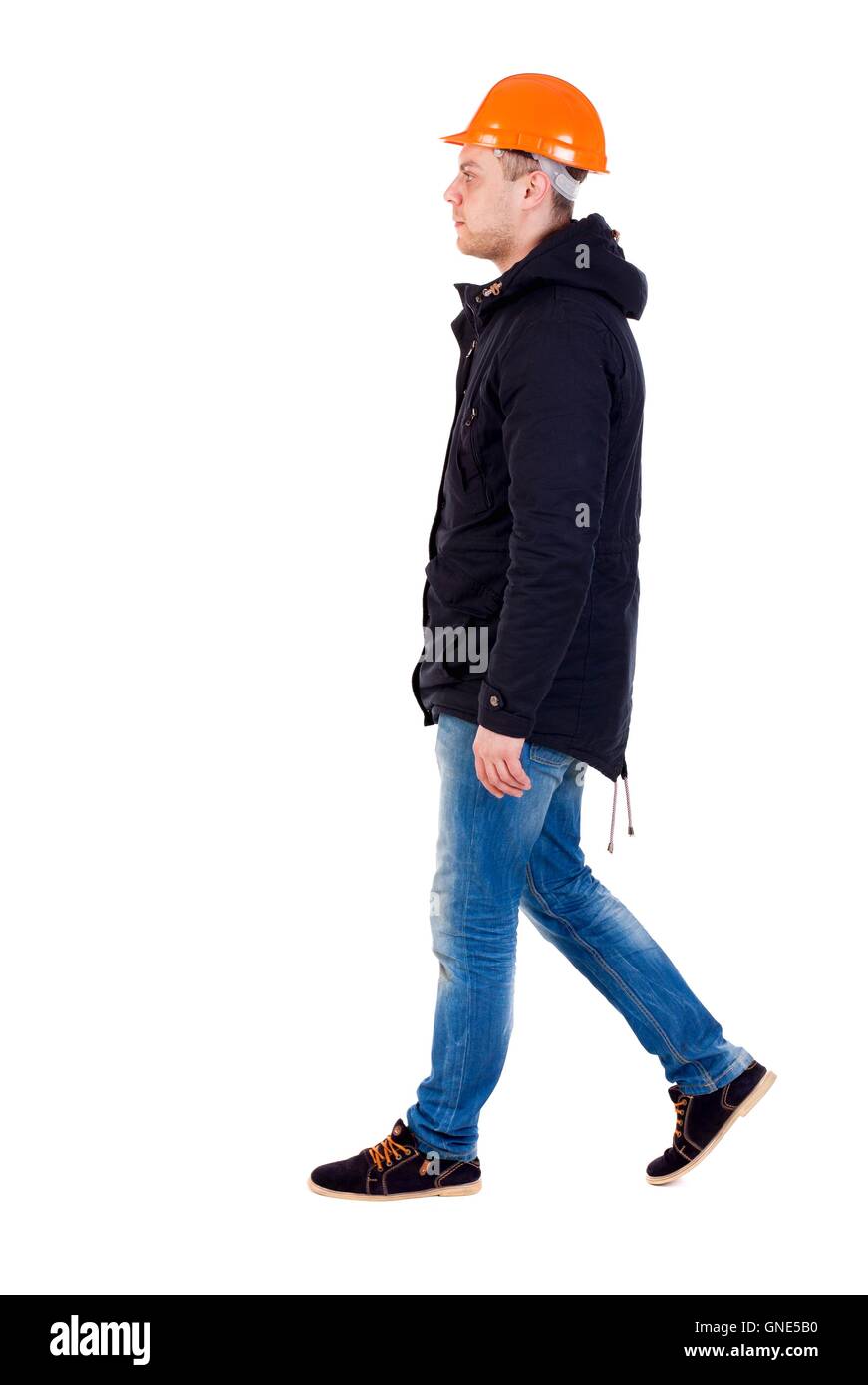 Back view of walking engineer in helmet Stock Photo - Alamy