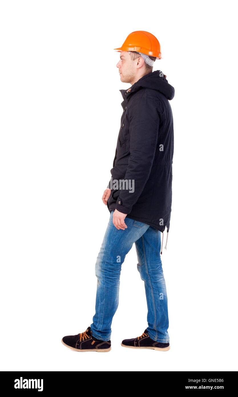 Back view of walking engineer in helmet Stock Photo - Alamy