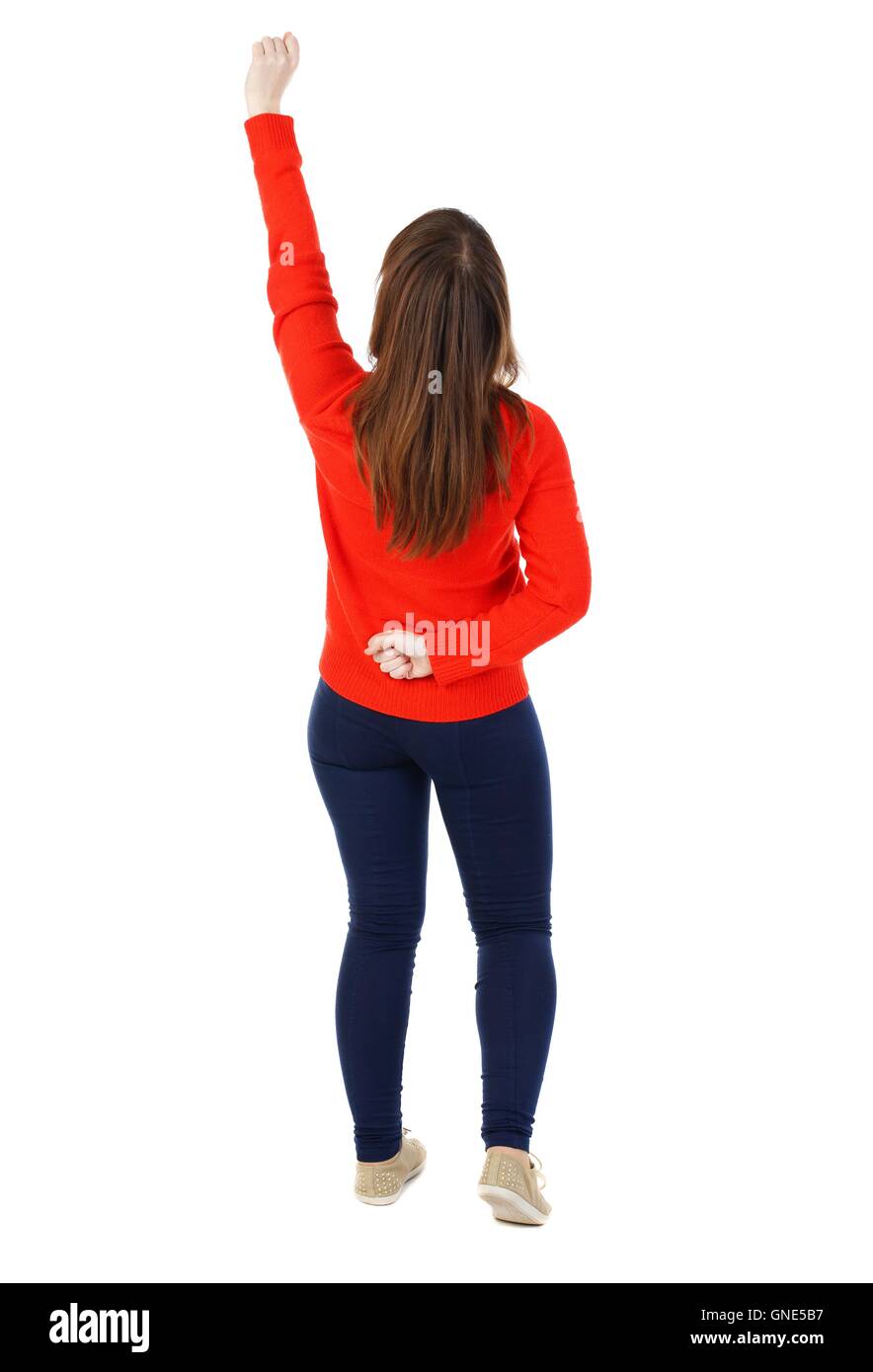 Back view of woman. Raised his fist up in victory sign Stock Photo - Alamy
