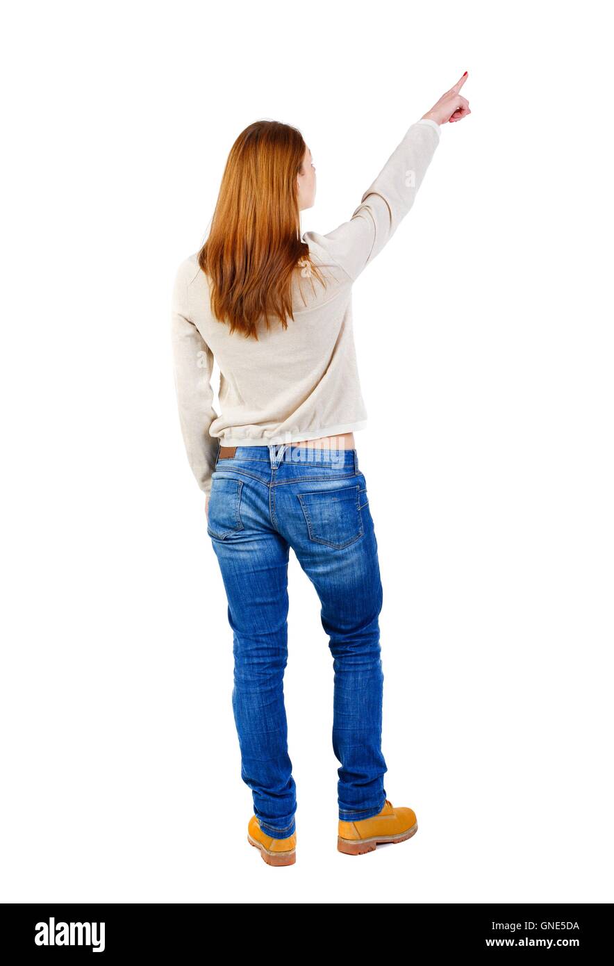 Back view of pointing woman. beautiful girl Stock Photo - Alamy