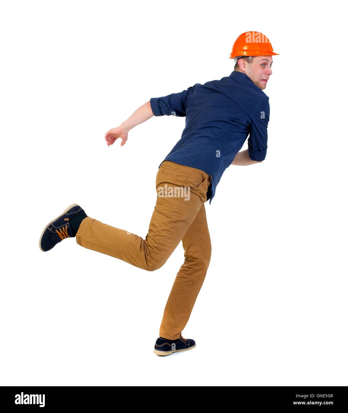 Back view of running engineer in helmet Stock Photo - Alamy