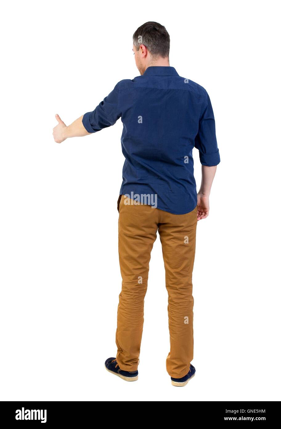 Back view of business man shows thumbs up Stock Photo - Alamy