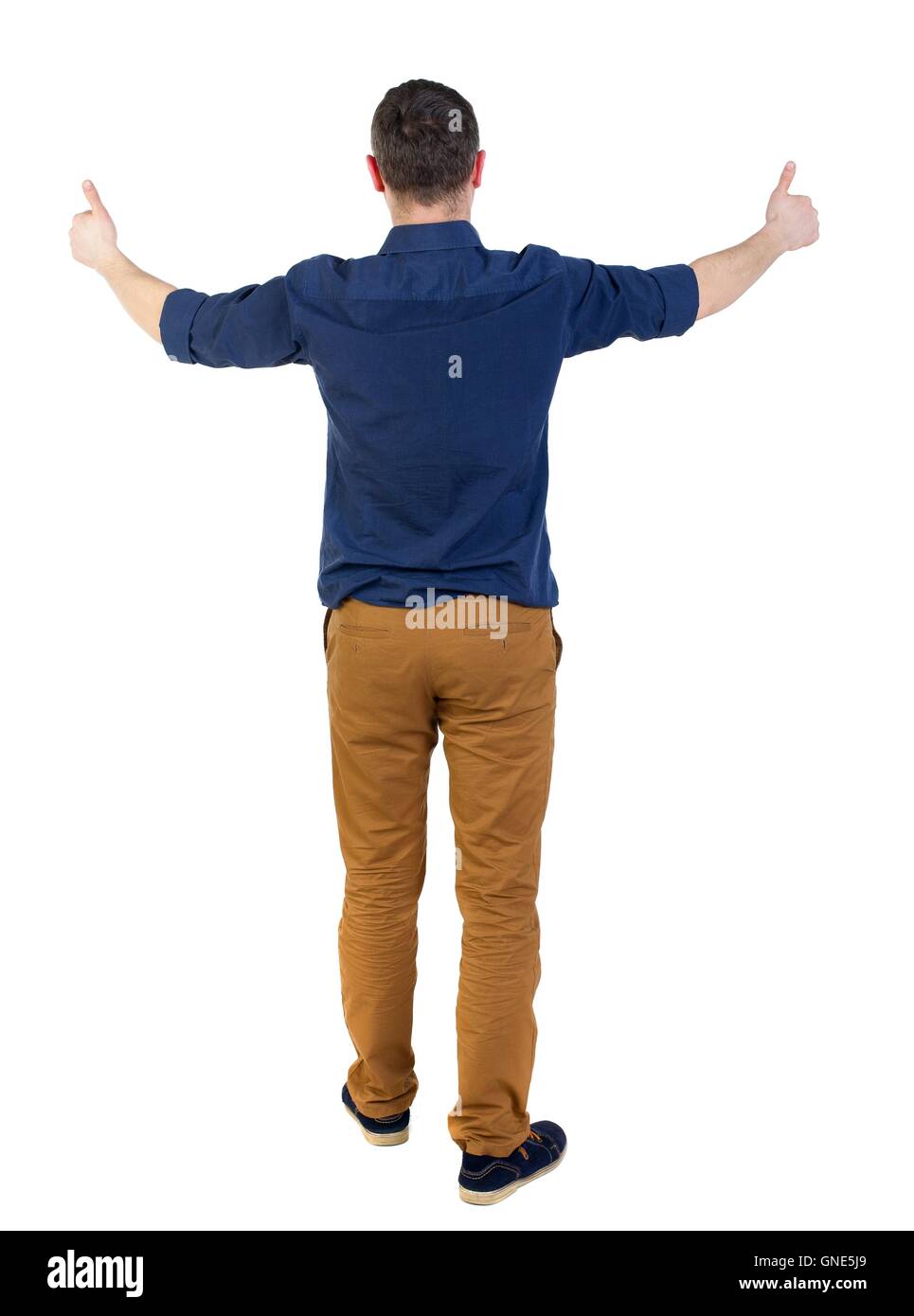 Back view of business man shows thumbs up Stock Photo - Alamy