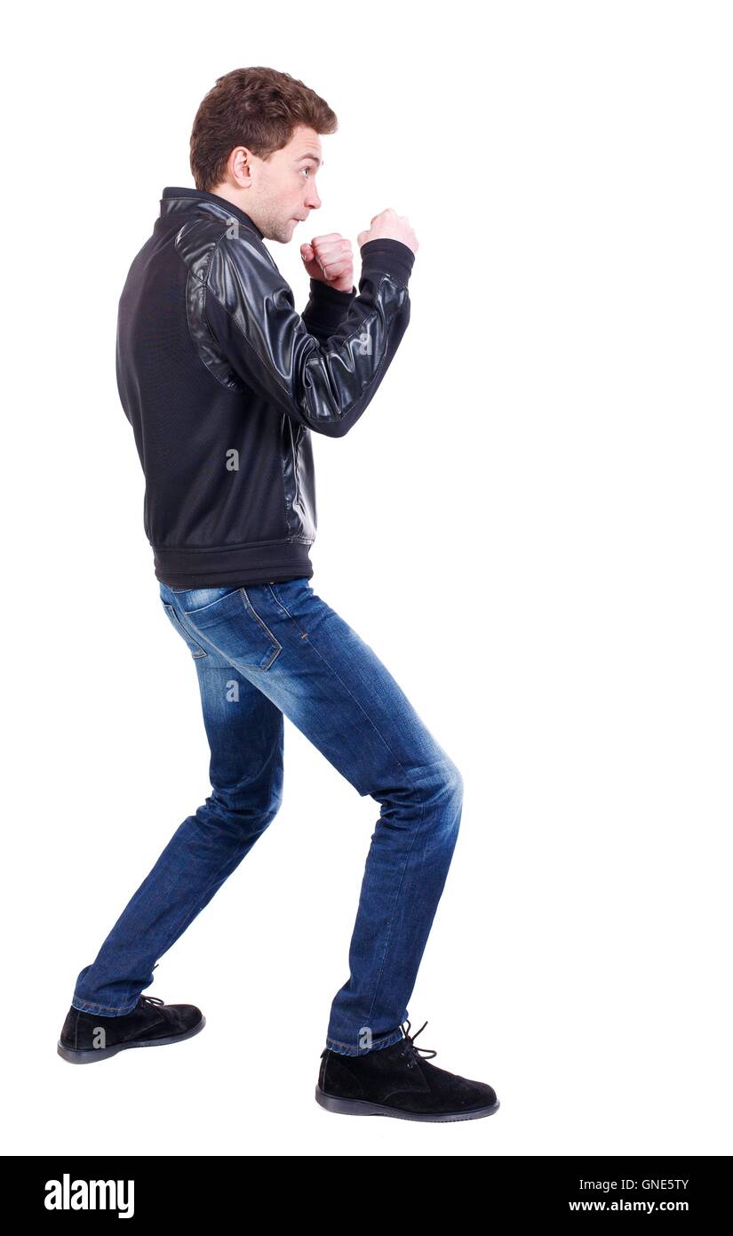 back view of guy funny fights waving his arms and legs Stock Photo - Alamy