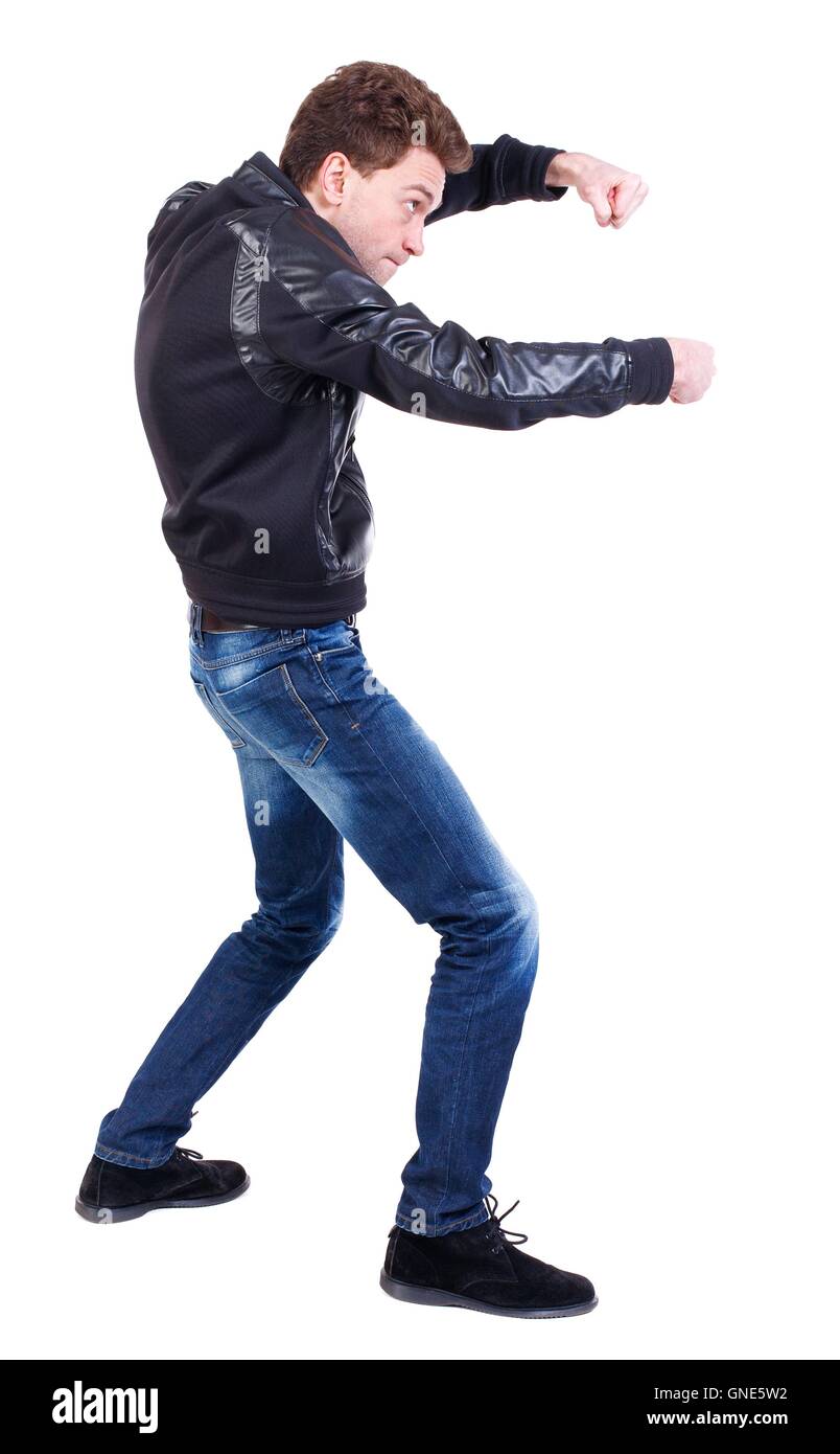 back view of guy funny fights waving his arms and legs Stock Photo - Alamy