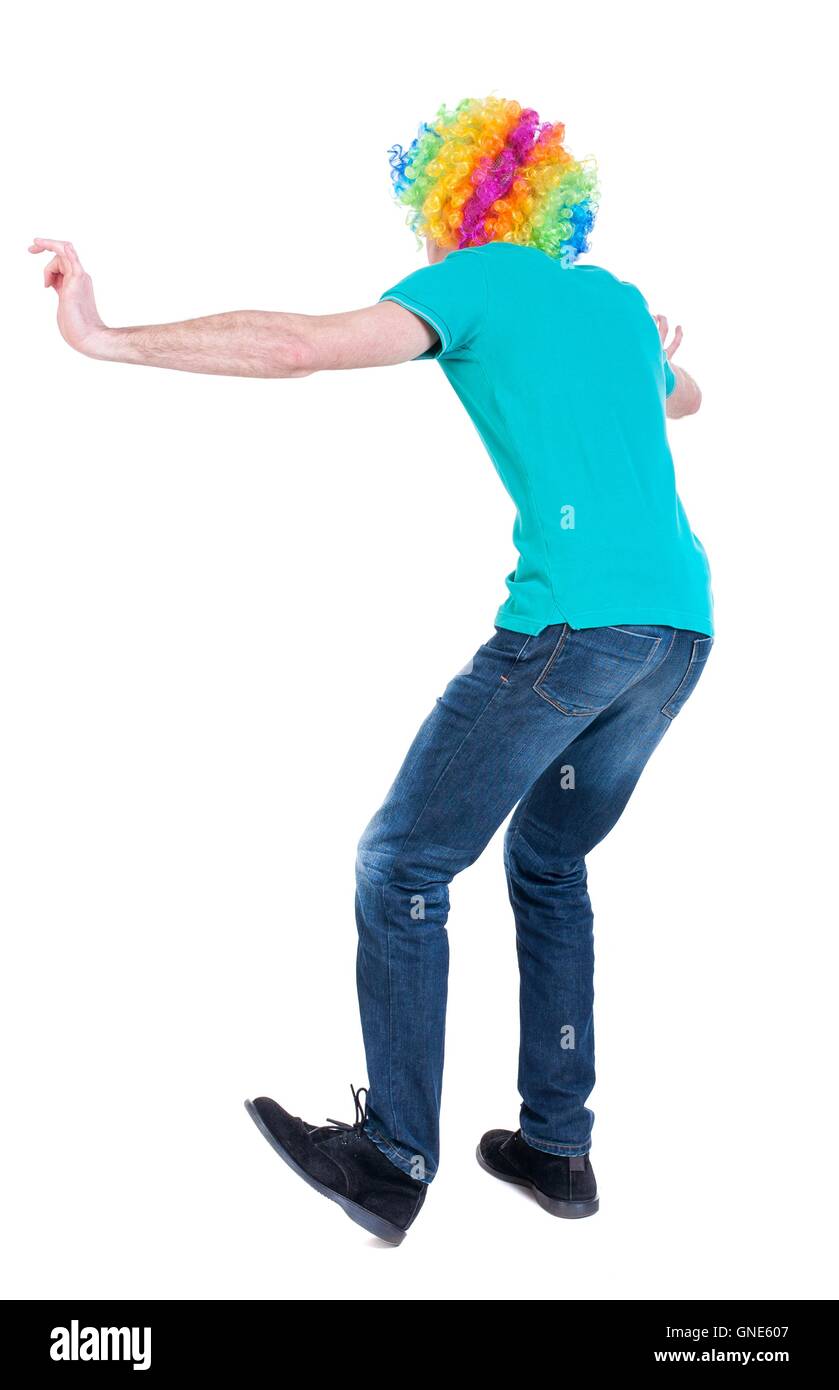 back view of dancing young beautiful man in clown wig Stock Photo - Alamy