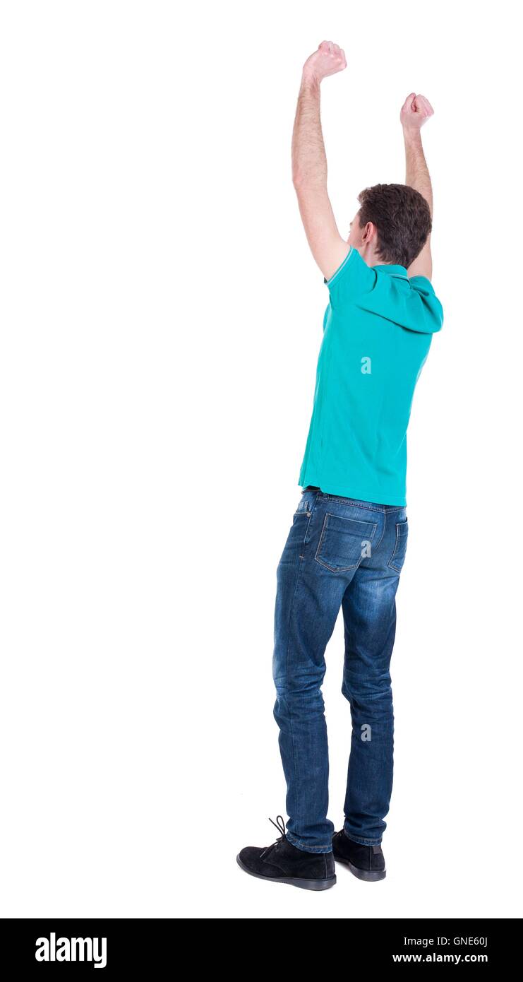 Back view of man. Raised his fist up in victory sign Stock Photo - Alamy