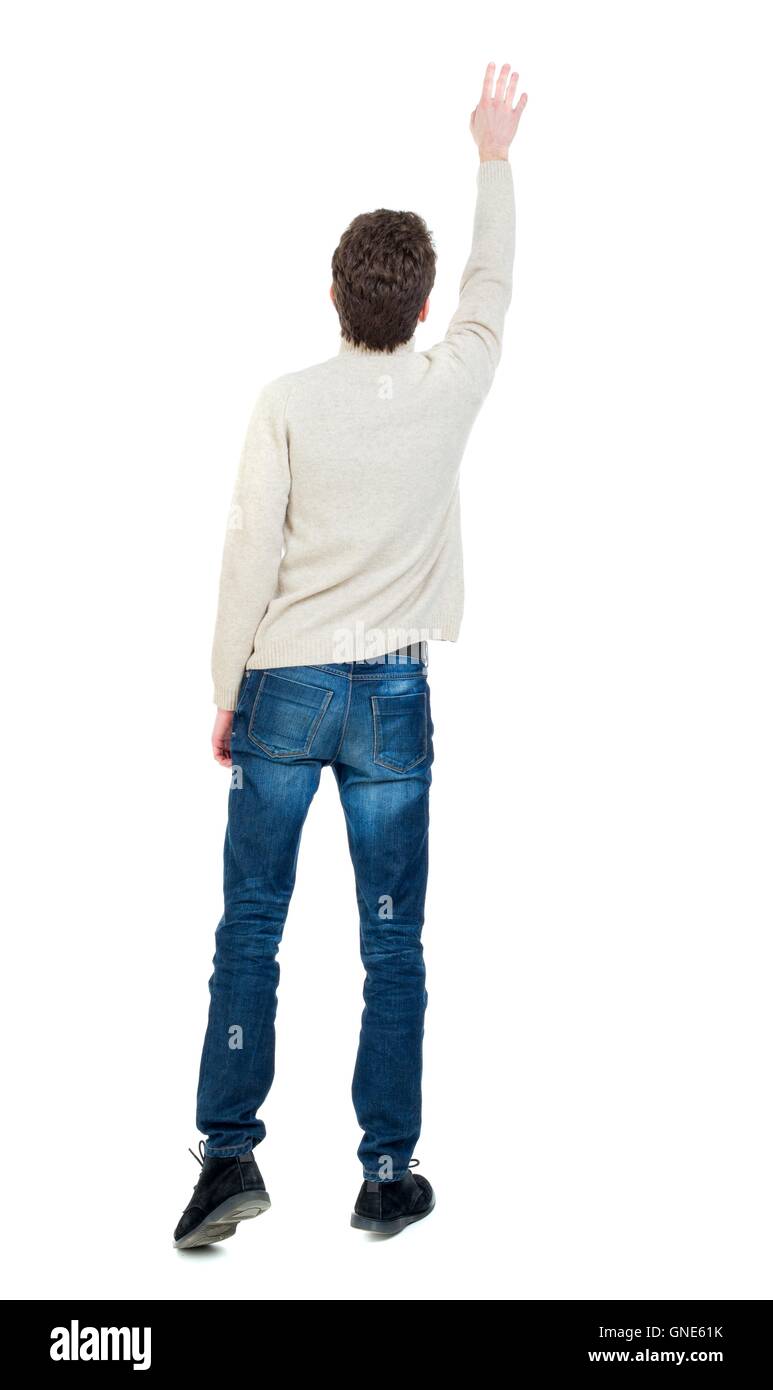Back view of man. Raised his fist up in victory sign Stock Photo - Alamy