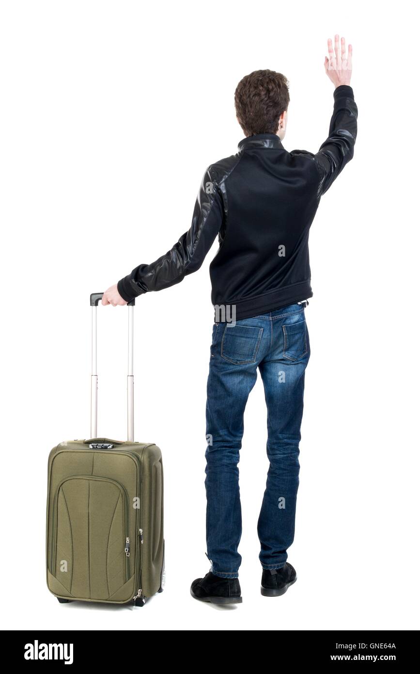Back view of man with a bag greeting waving from his hands Stock Photo ...