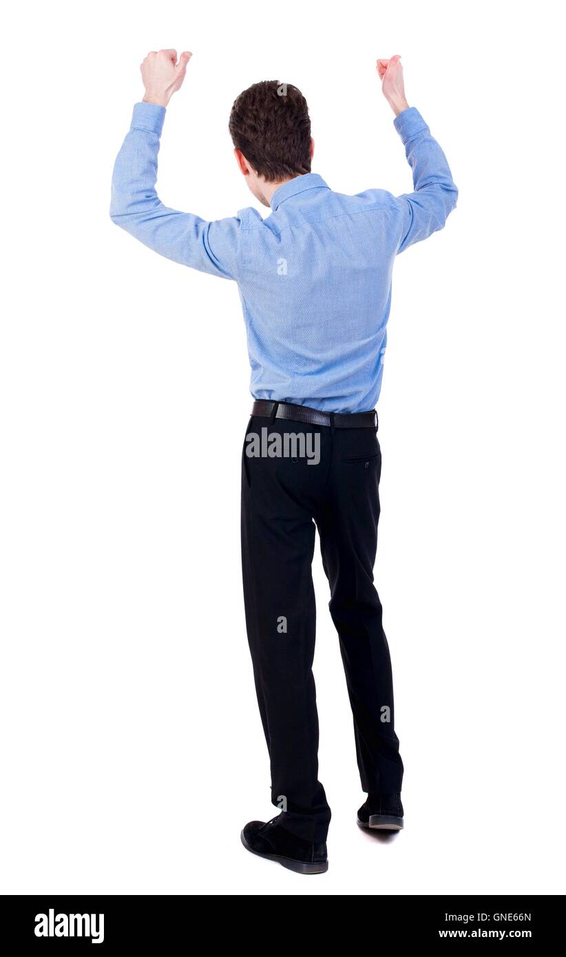 Back view of man. Raised his fist up in victory sign Stock Photo - Alamy