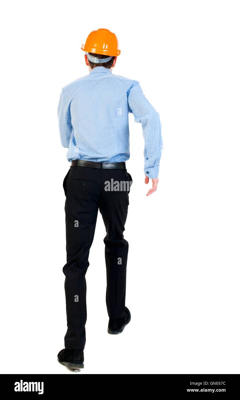 Back view of running engineer in helmet Stock Photo - Alamy