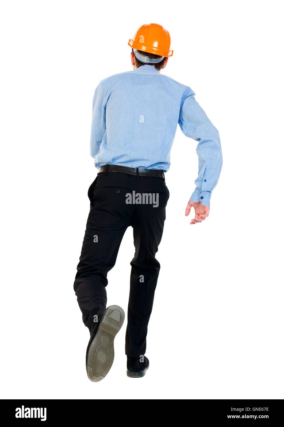 Back view of running engineer in helmet Stock Photo - Alamy