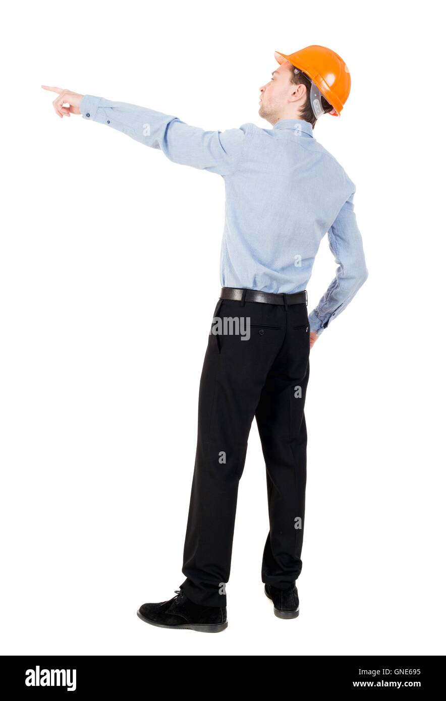 Back view of pointing young men in helmet Stock Photo - Alamy