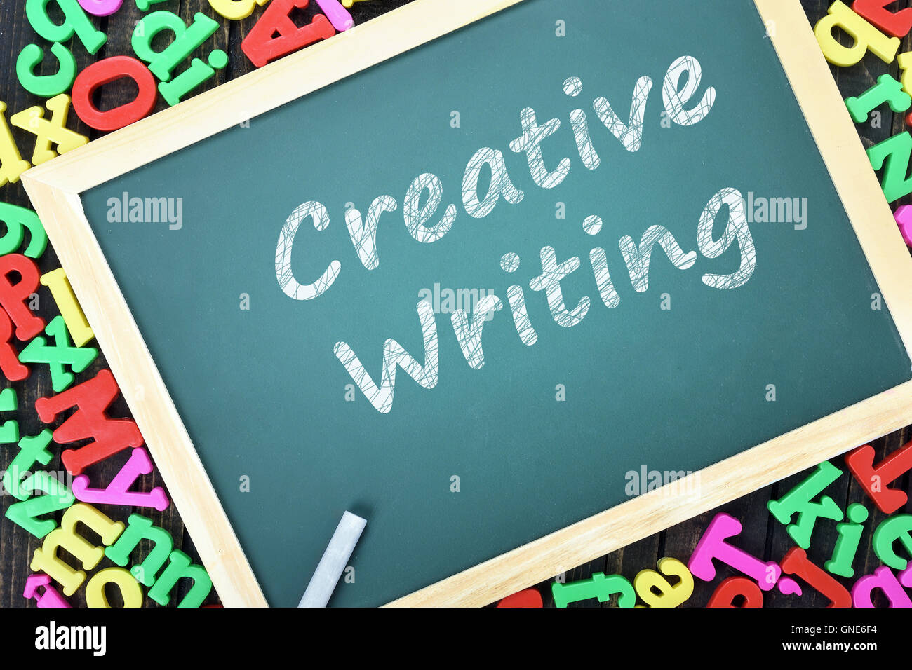 Creative Writing text on school board and magnetic letters Stock Photo ...