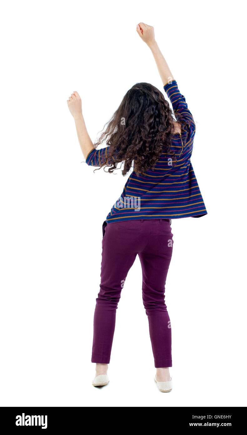 back view of dancing young beautiful woman. girl watching Stock Photo ...