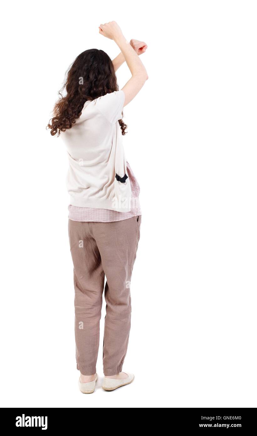 back view of dancing young beautiful woman. girl watching Stock Photo ...