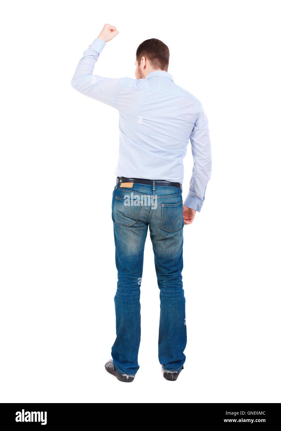 Back view of man. Raised his fist up in victory sign Stock Photo - Alamy