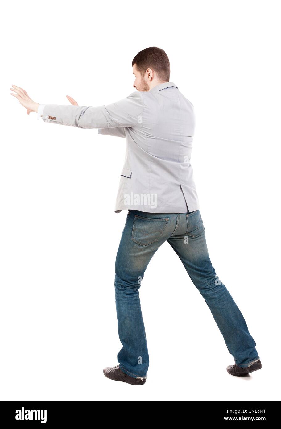 back view of business man pushes wall Stock Photo - Alamy