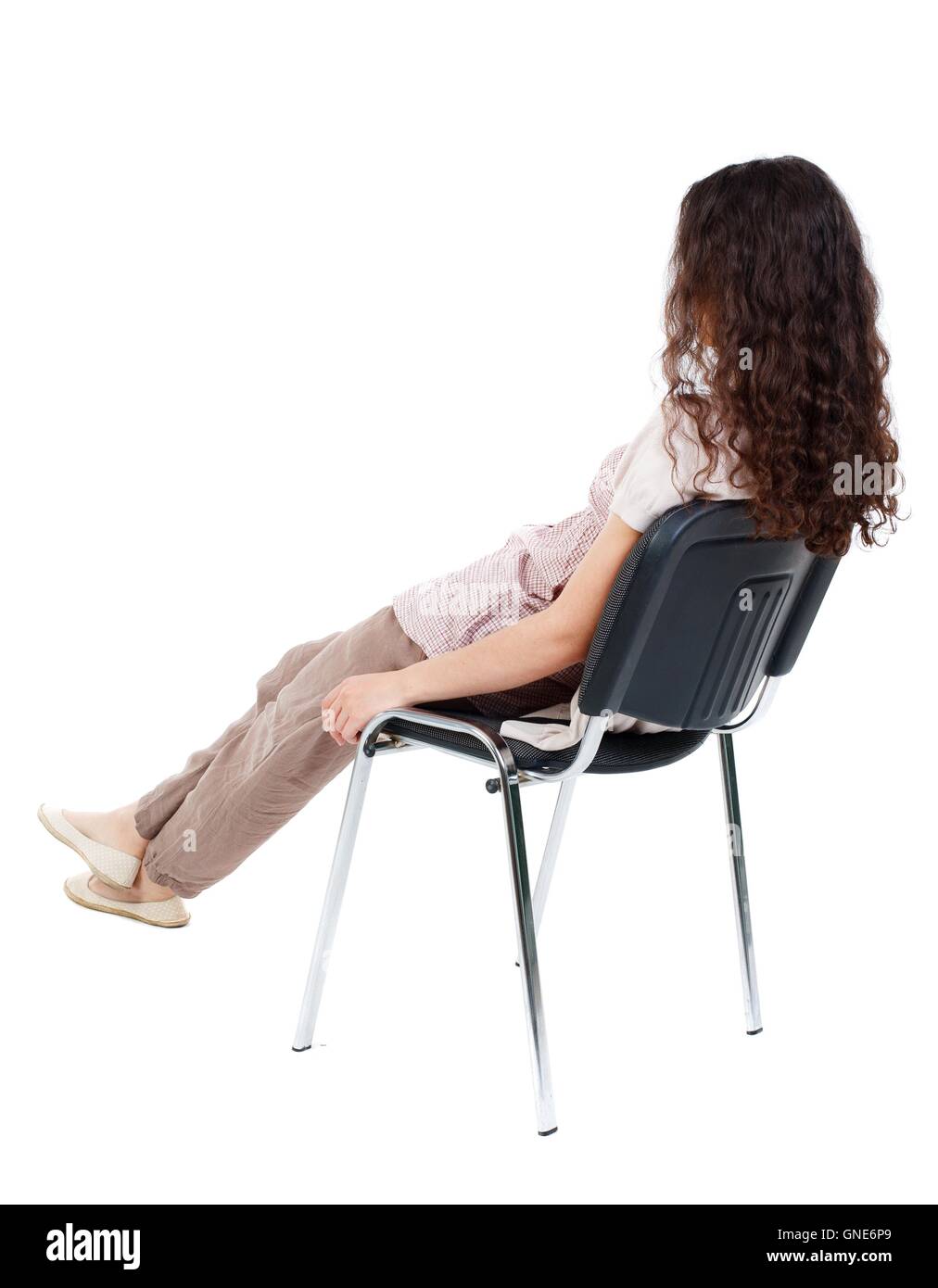 back view of young beautiful woman sitting on chair Stock Photo - Alamy