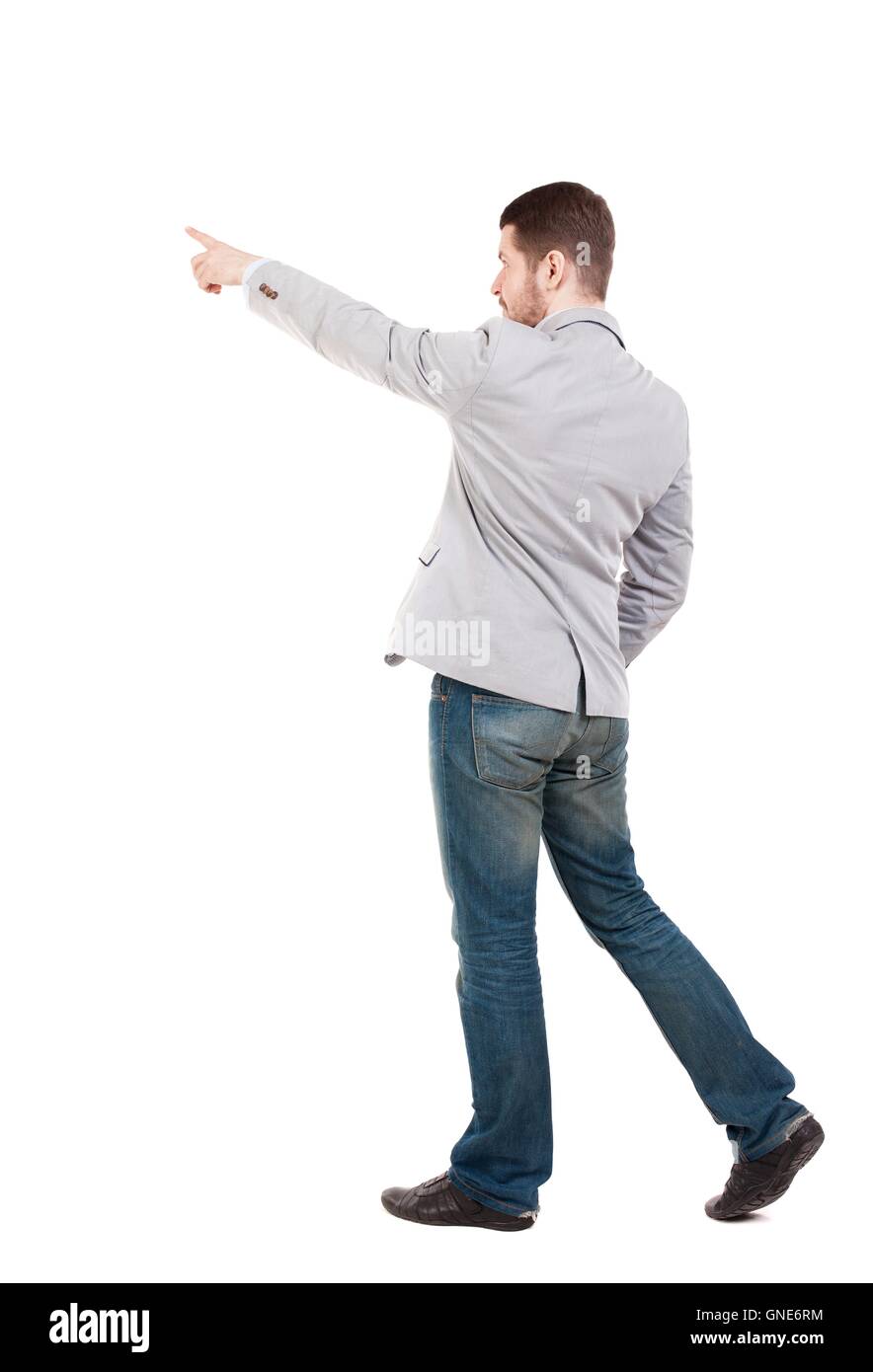 Back view of going business man pointing Stock Photo - Alamy