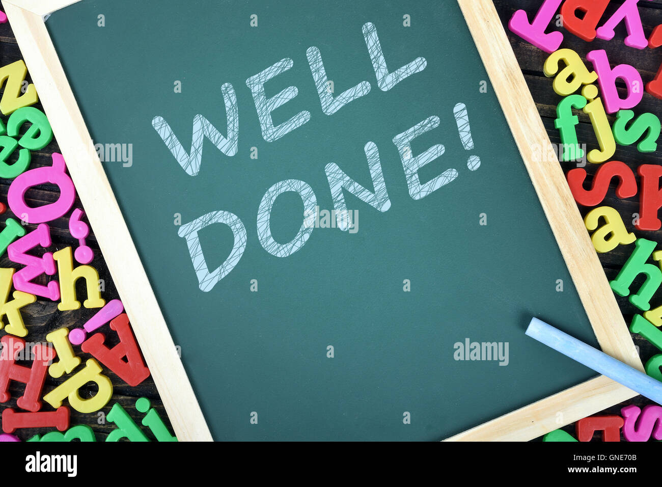Well Done text on school board and magnetic letters Stock Photo - Alamy