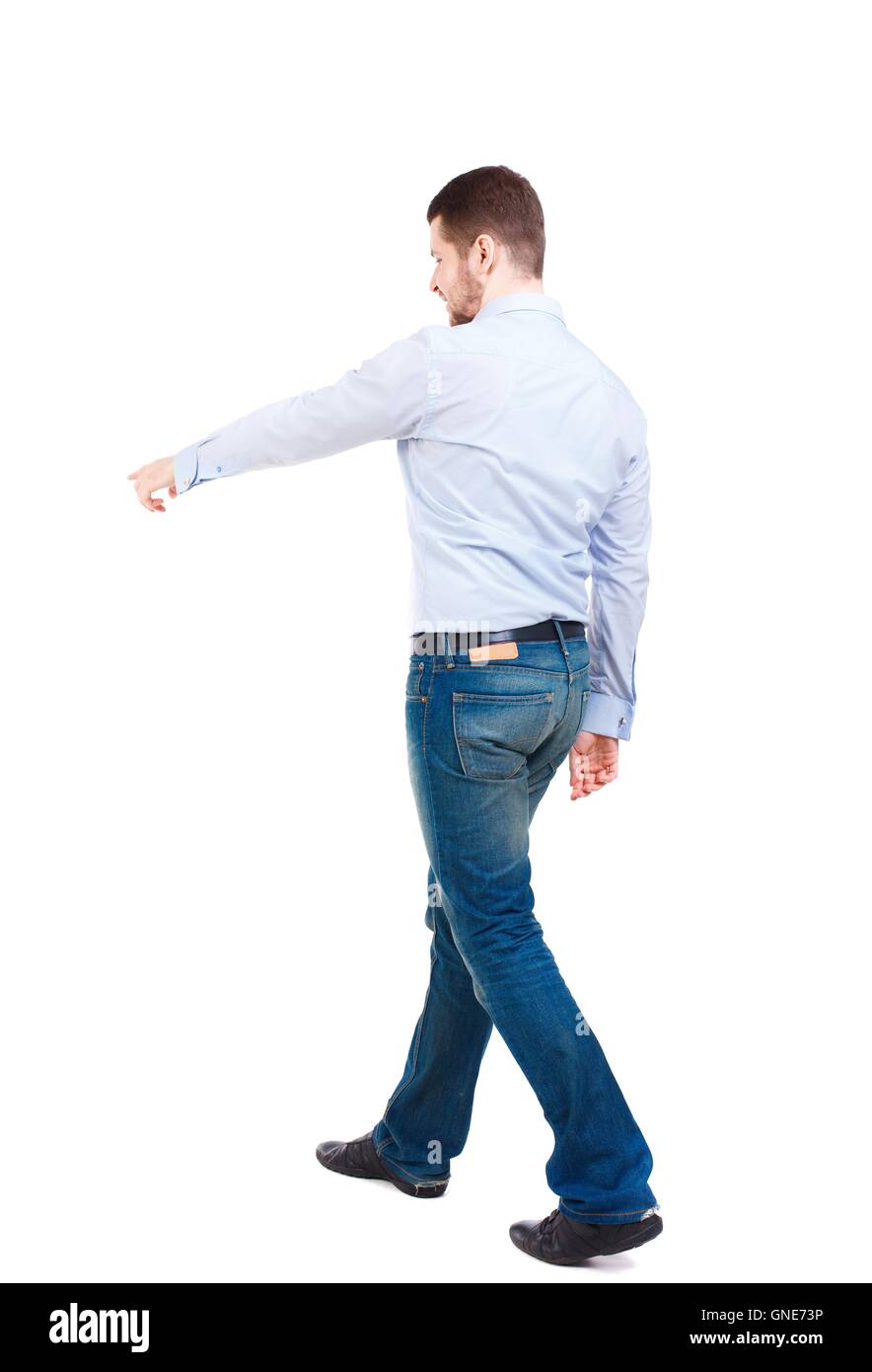 Back view of going business man pointing Stock Photo - Alamy