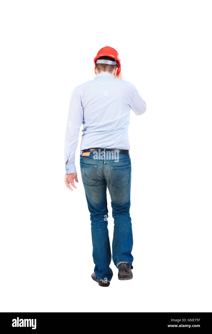 Back view of walking engineer in helmet Stock Photo - Alamy