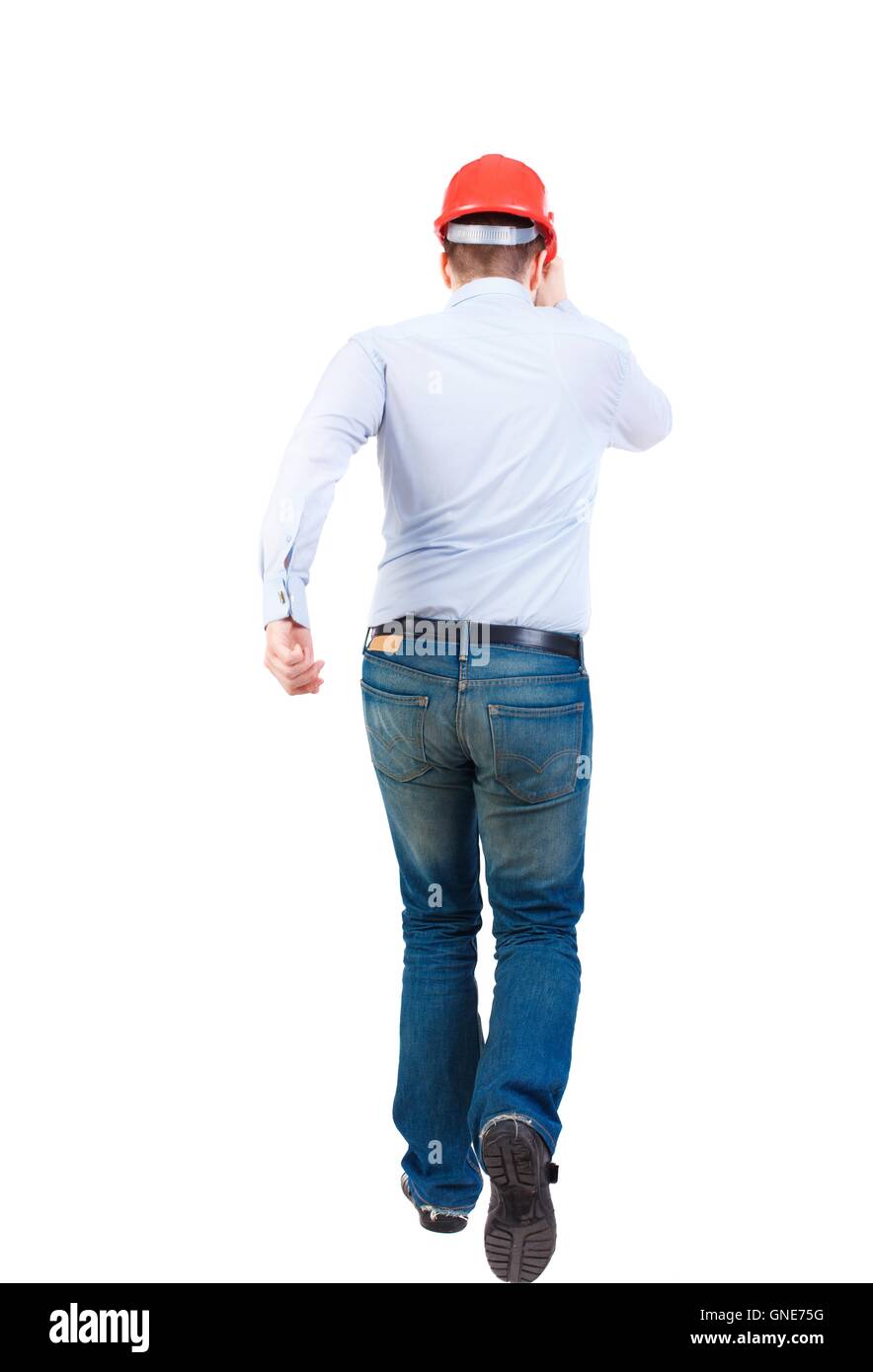 Back view of running engineer in helmet Stock Photo - Alamy