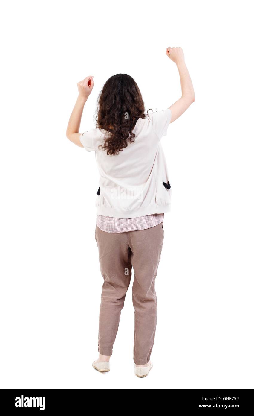 back view of dancing young beautiful woman. girl watching Stock Photo ...