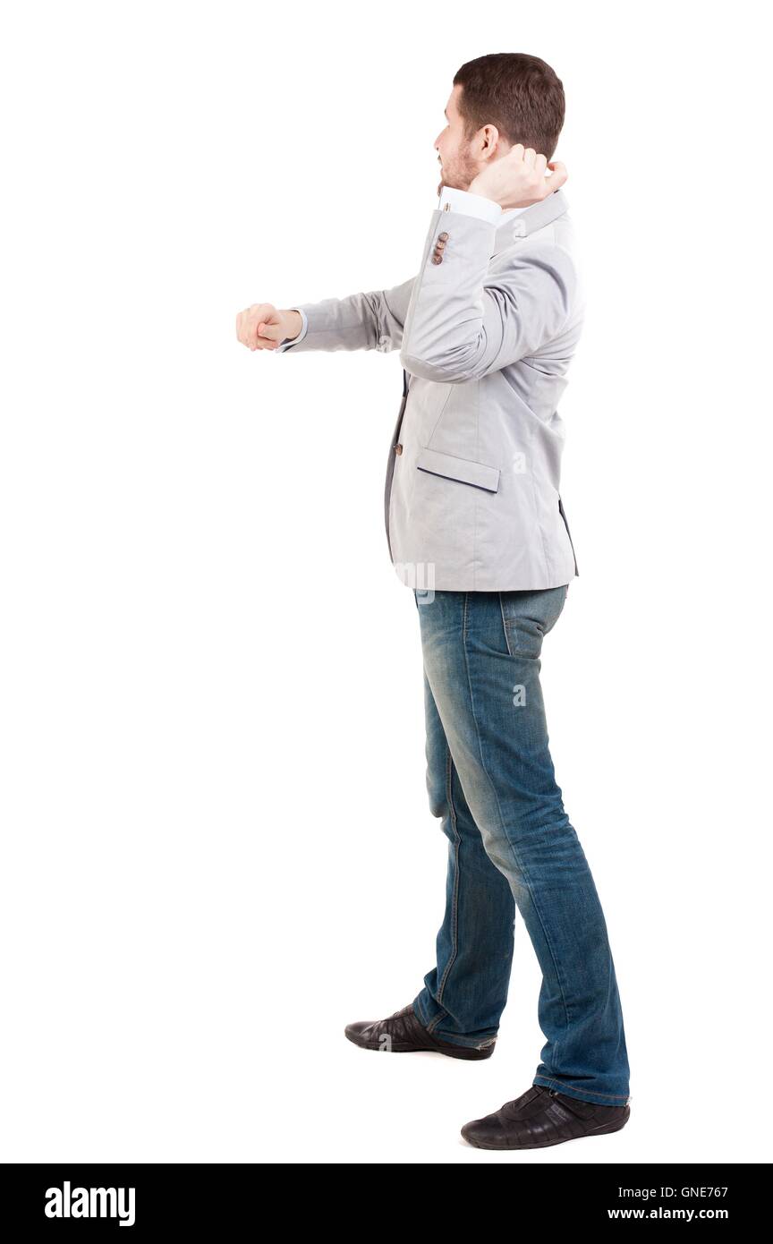 back view of guy funny fights waving his arms and legs Stock Photo - Alamy