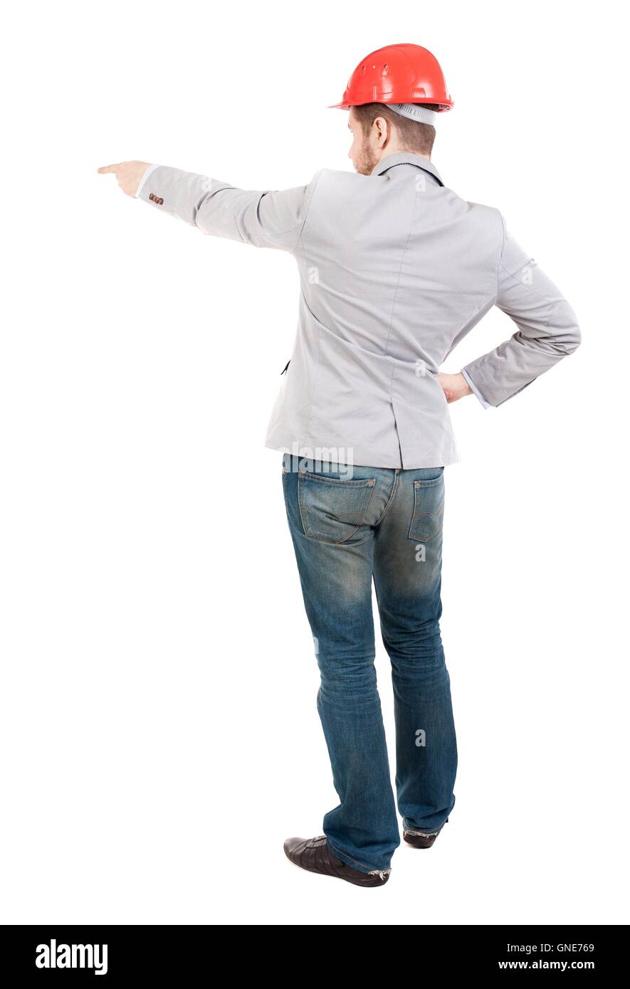 Back view of pointing young men in helmet Stock Photo - Alamy
