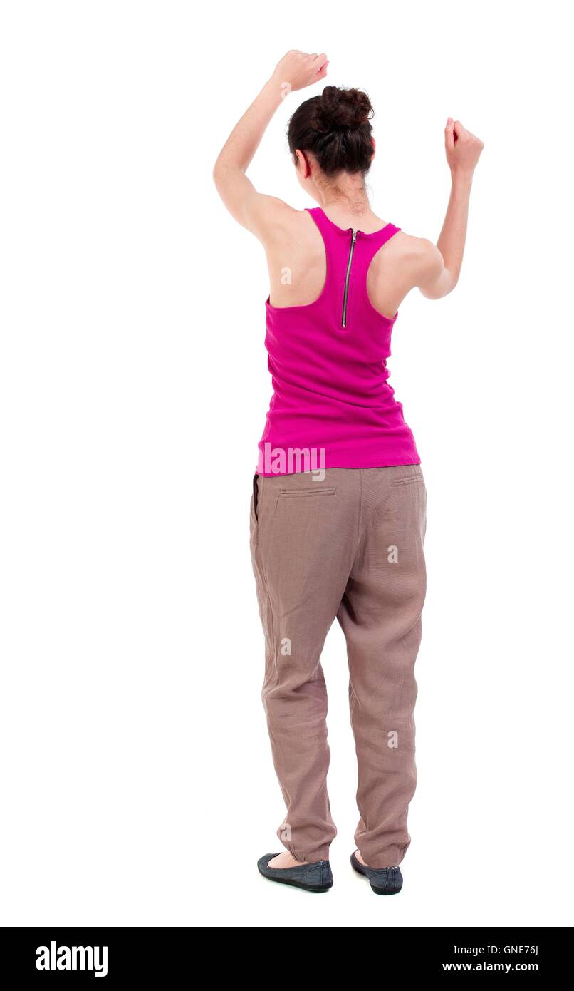 back view of dancing young beautiful woman. girl watching Stock Photo ...