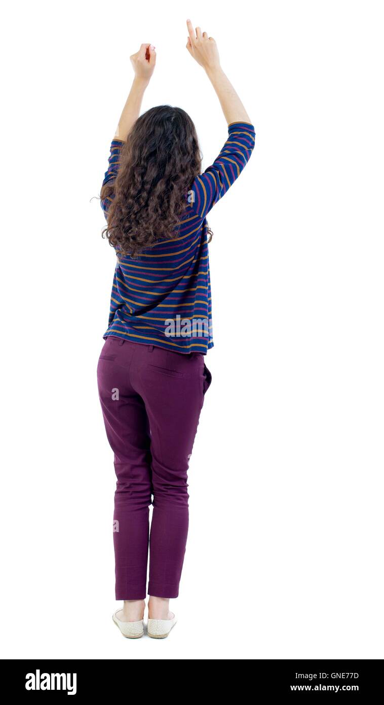 back view of dancing young beautiful woman. girl watching Stock Photo ...