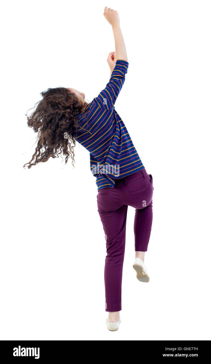 back view of dancing young beautiful woman. girl watching Stock Photo ...