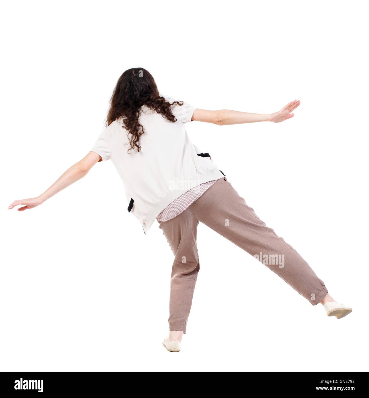 Balancing young woman Stock Photo - Alamy