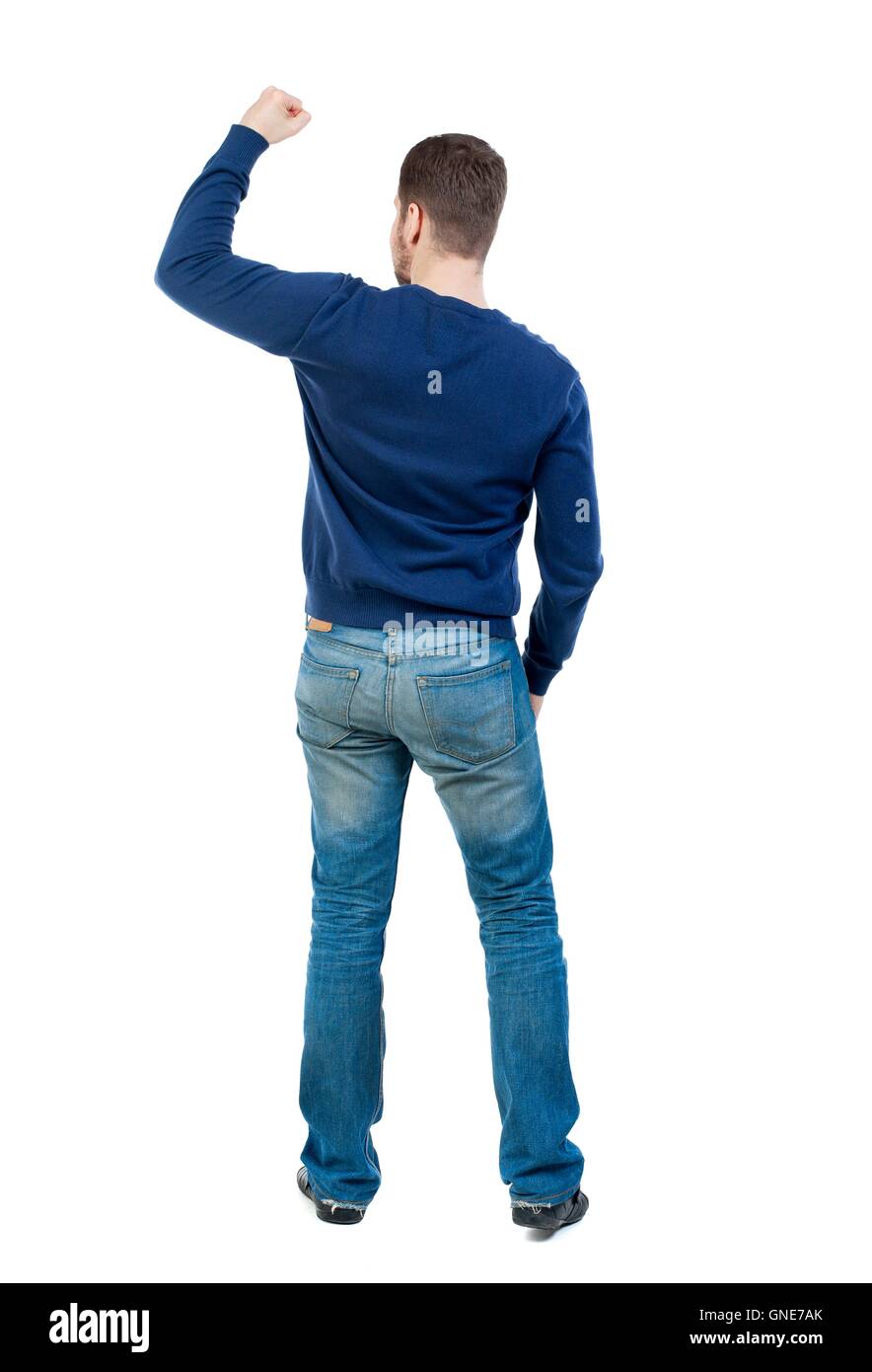 Back view of man. Raised his fist up in victory sign Stock Photo - Alamy