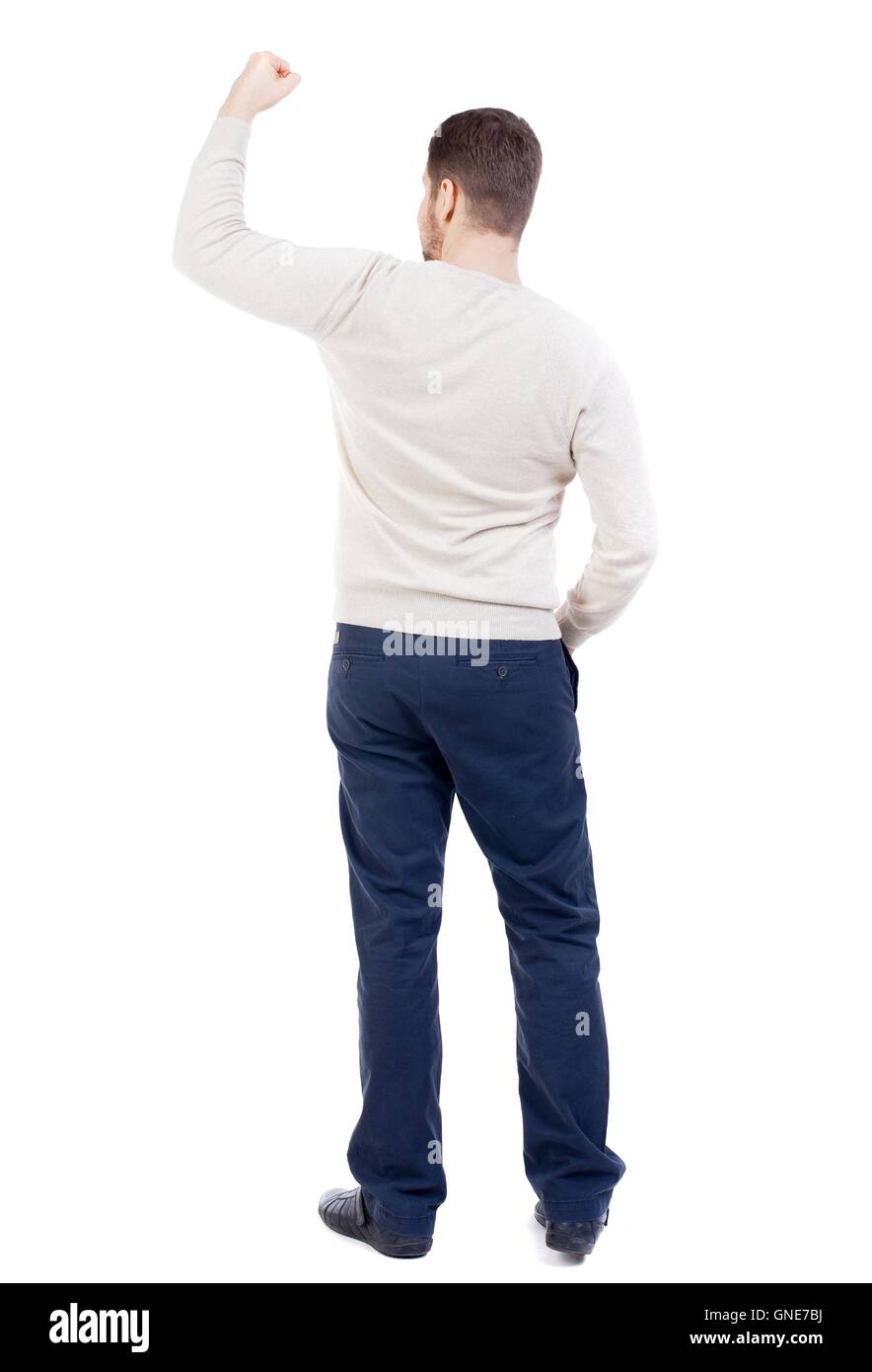Back view of man. Raised his fist up in victory sign Stock Photo - Alamy