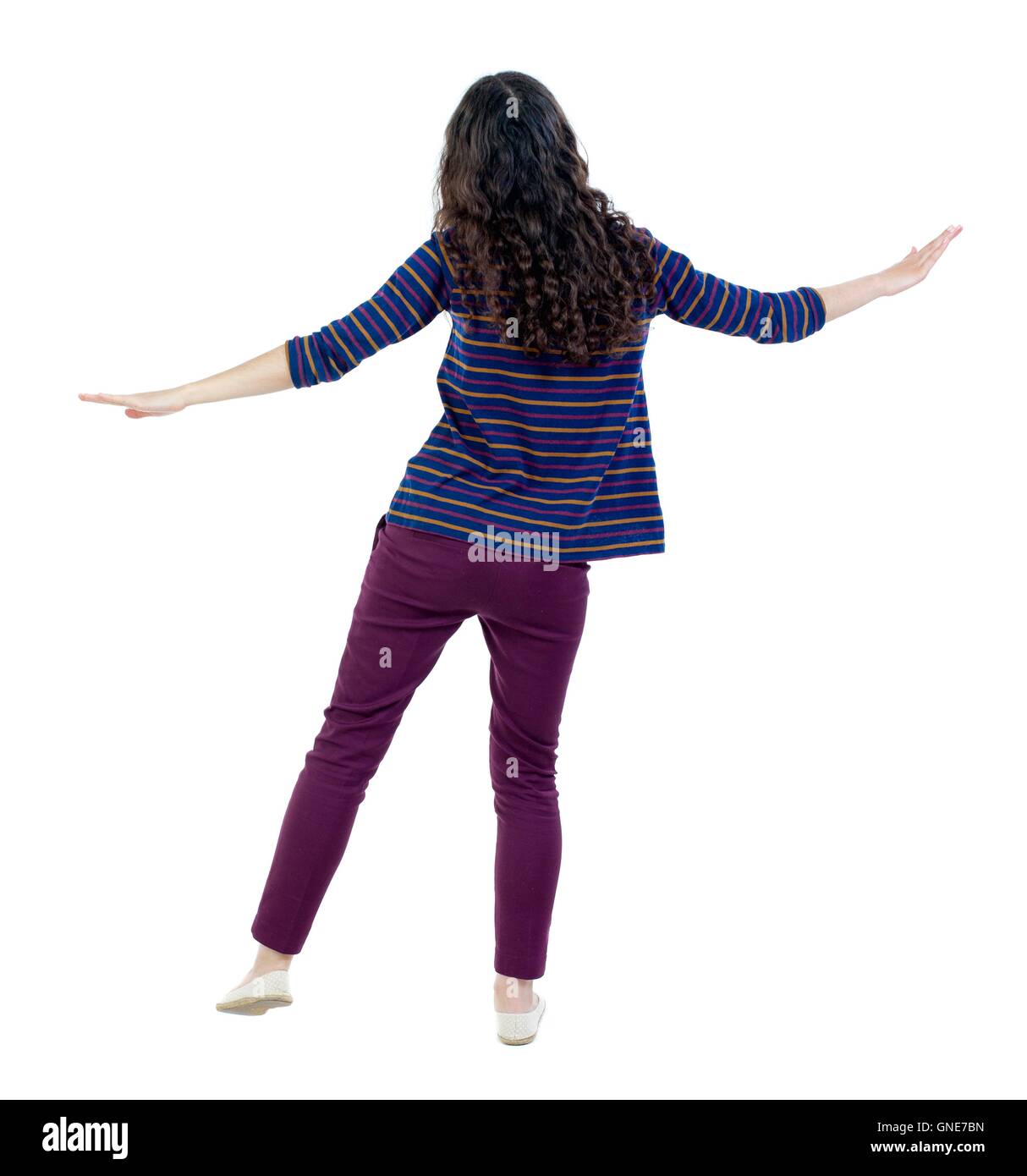 Balancing young woman Stock Photo - Alamy