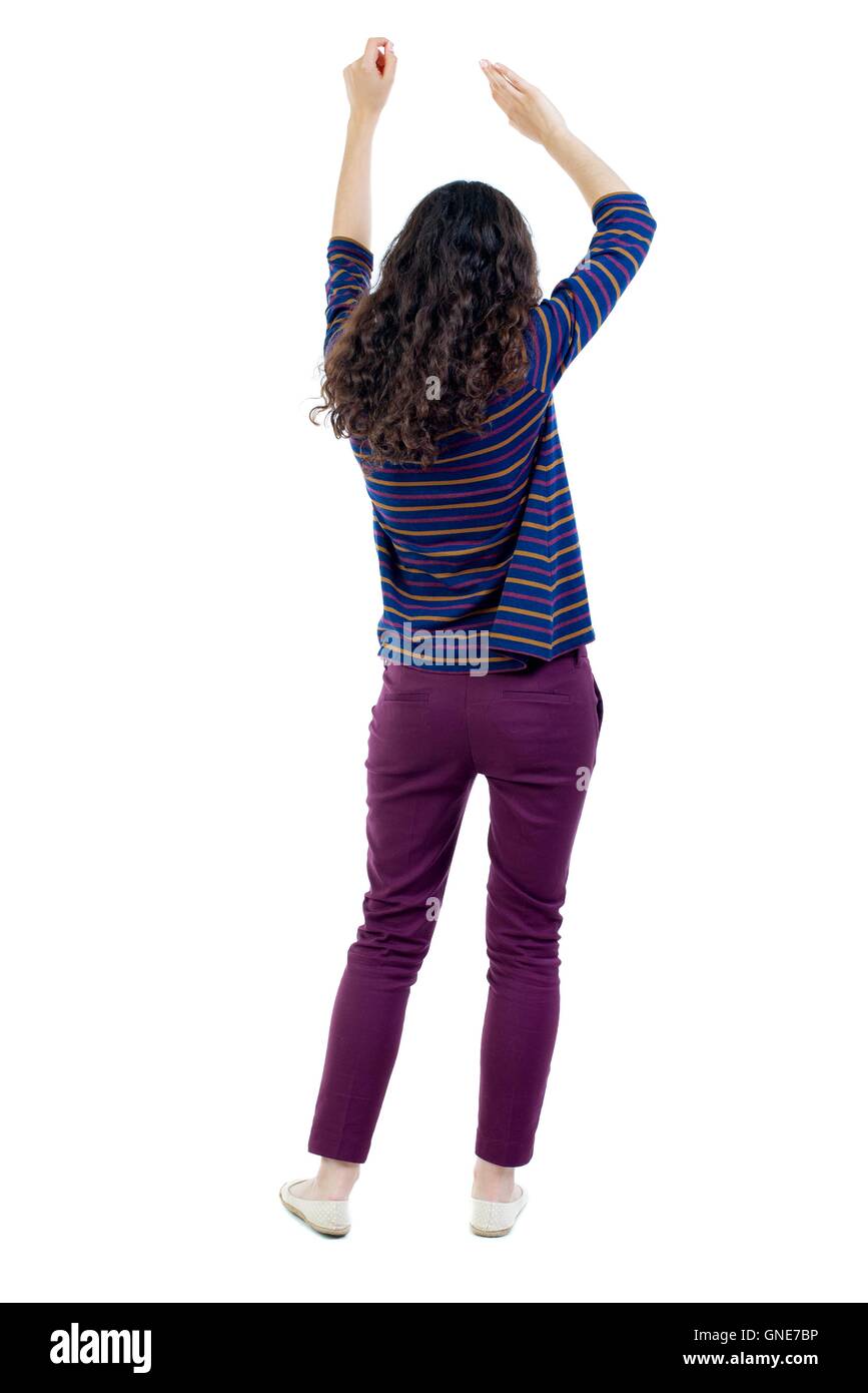 back view of dancing young beautiful woman. girl watching Stock Photo ...
