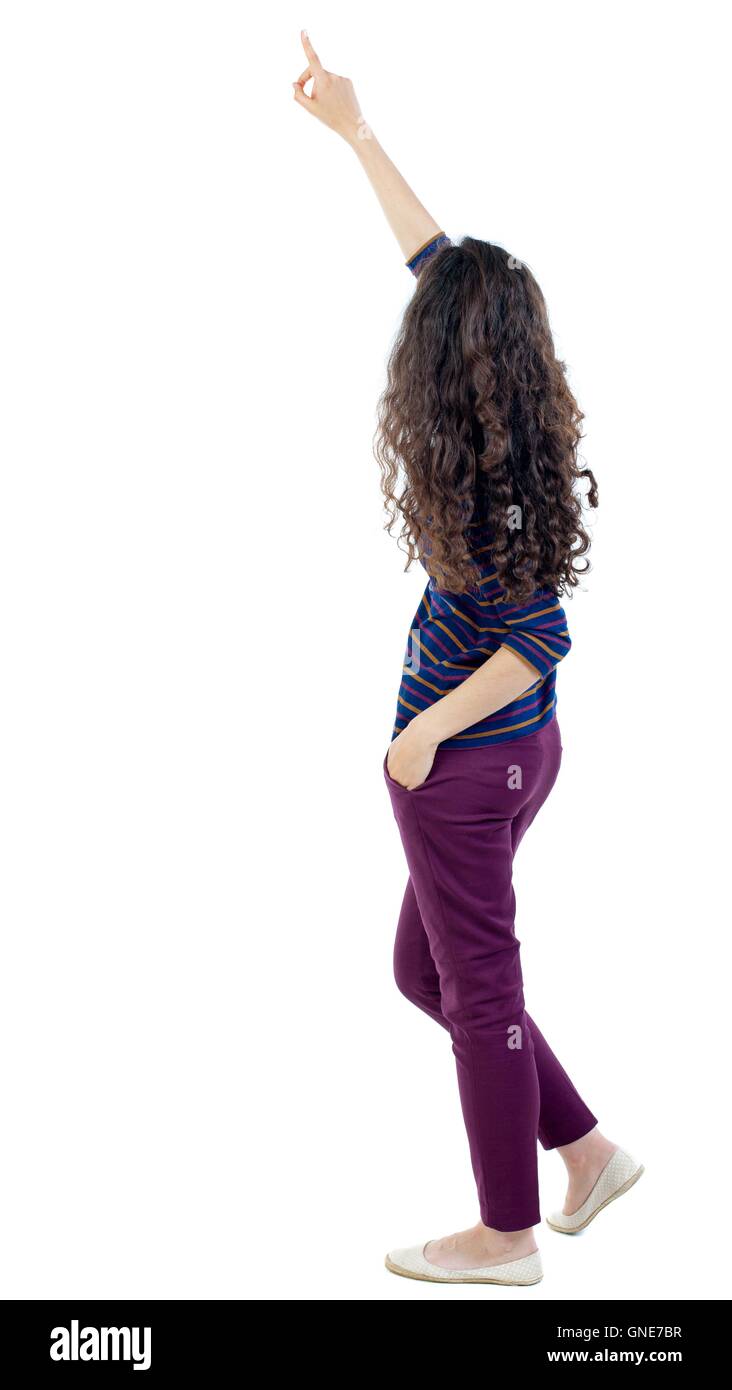 Back view of pointing woman. beautiful girl Stock Photo - Alamy