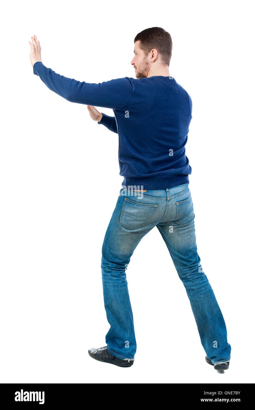 back view of business man pushes wall Stock Photo - Alamy