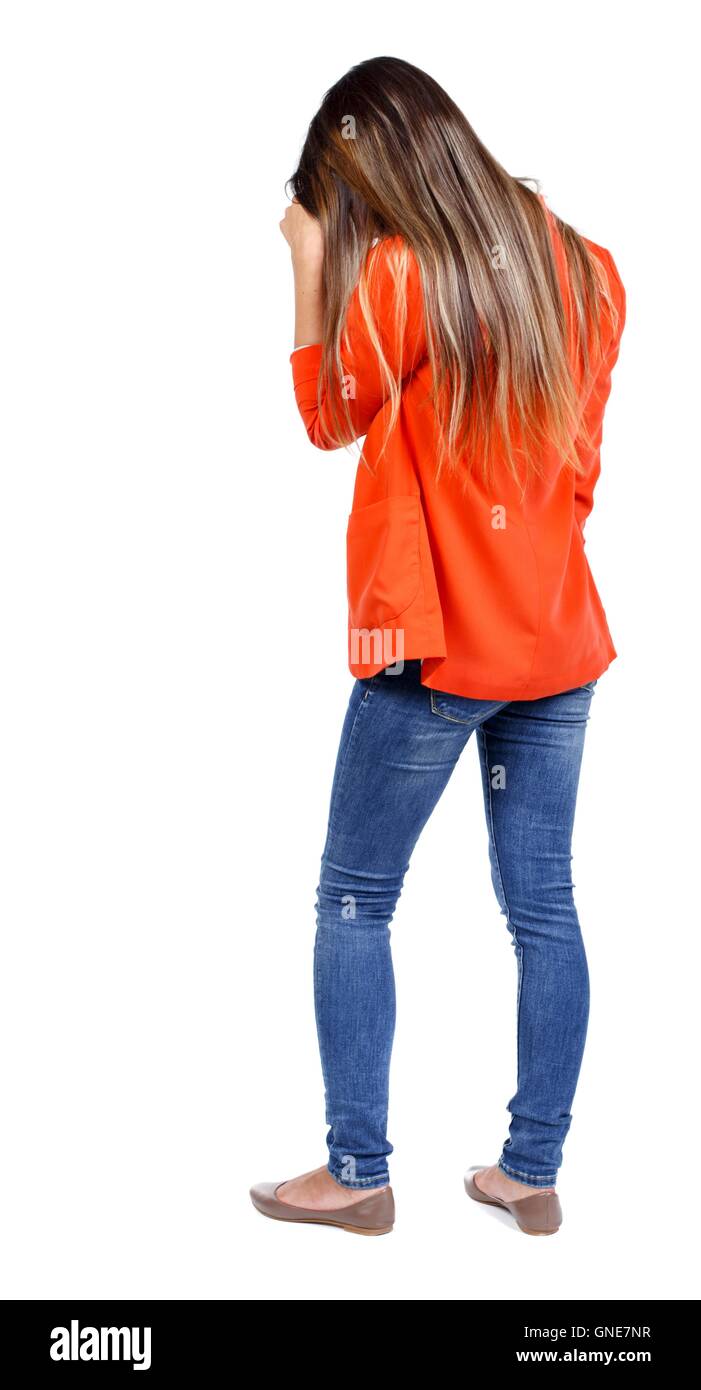 back view of standing young beautiful woman. Girl scratching h Stock ...