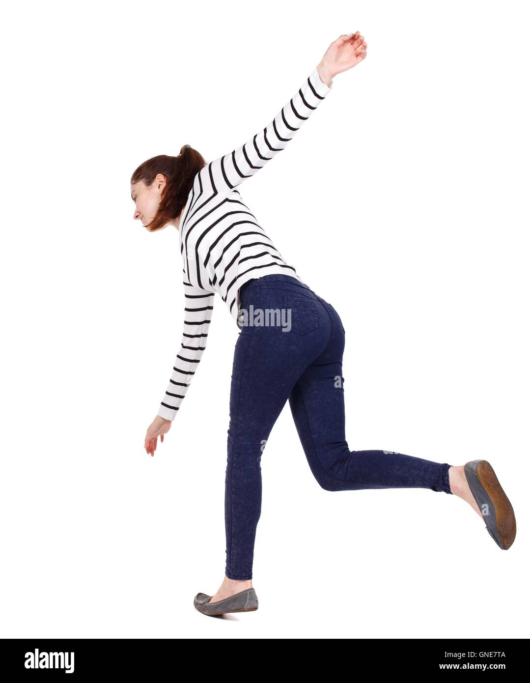 Balancing young woman Stock Photo - Alamy