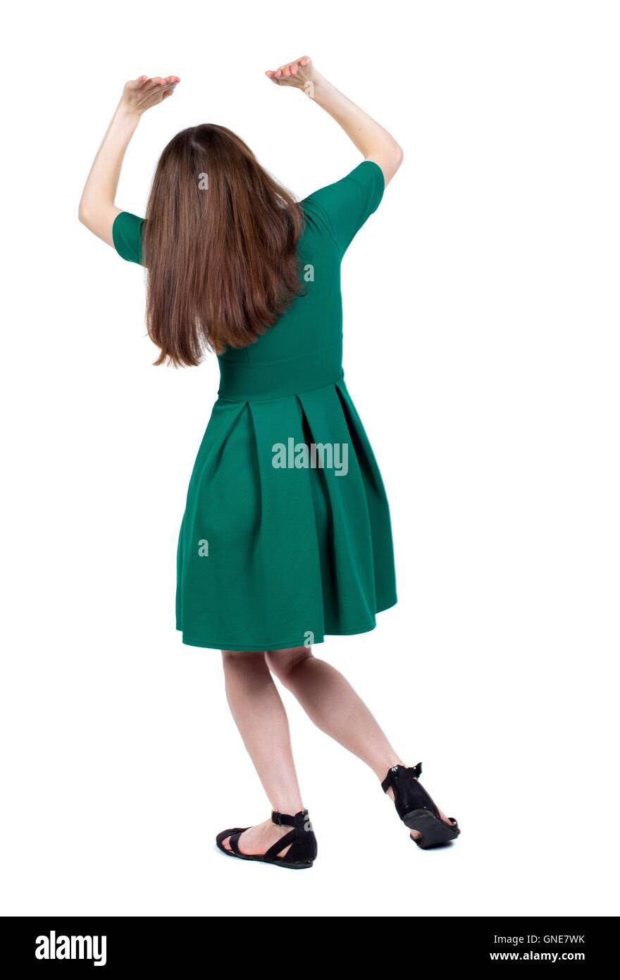 back view of woman protects hands from what is falling Stock Photo - Alamy