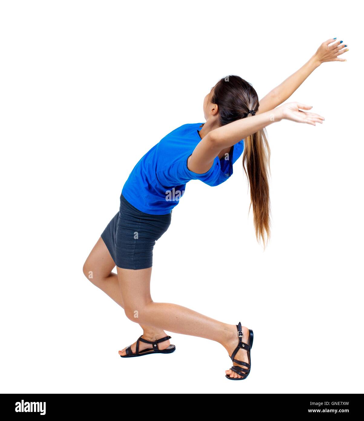 Woman balancing rear view Cut Out Stock Images & Pictures - Alamy