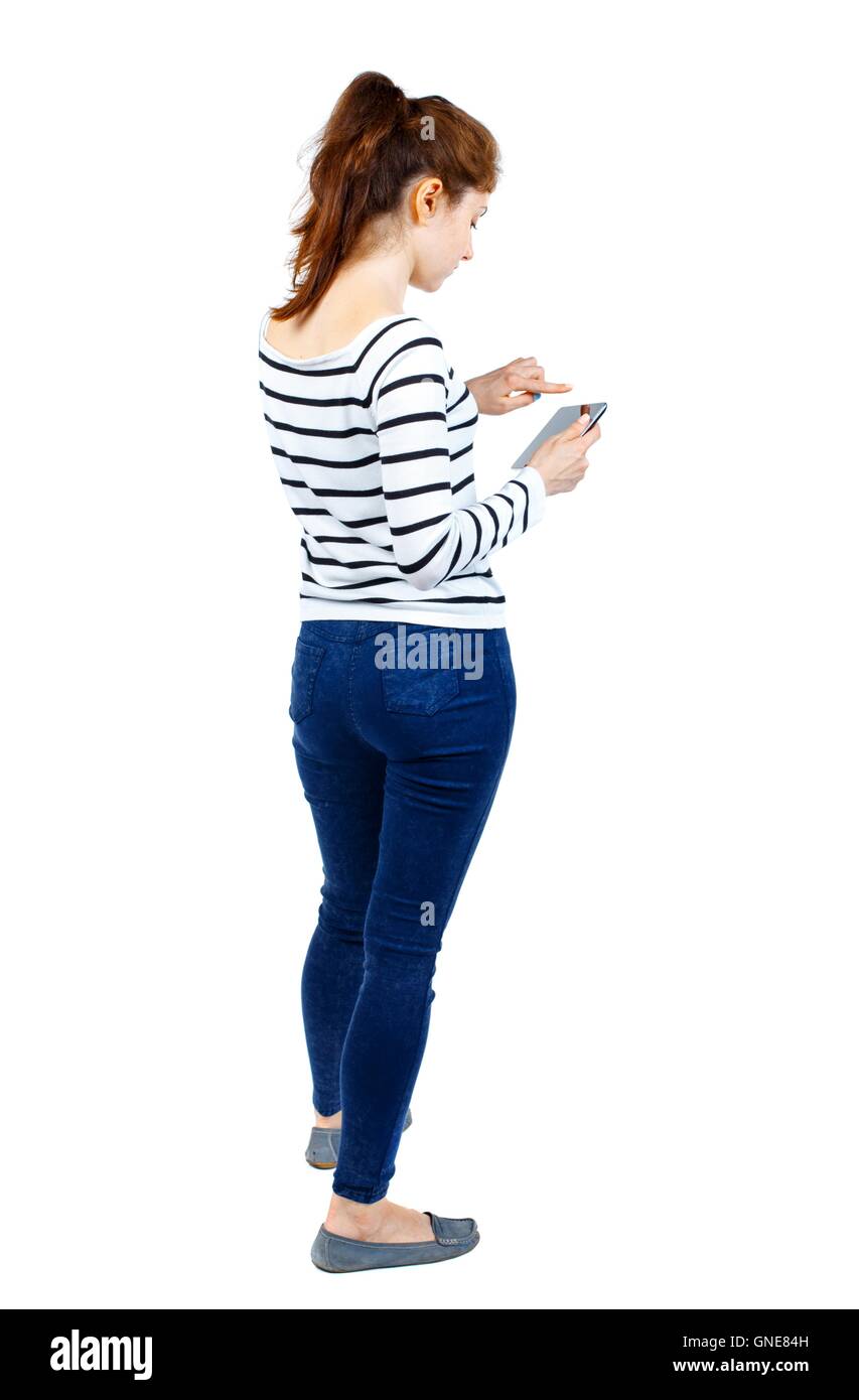 back view of standing young beautiful woman using a mobile phon Stock ...