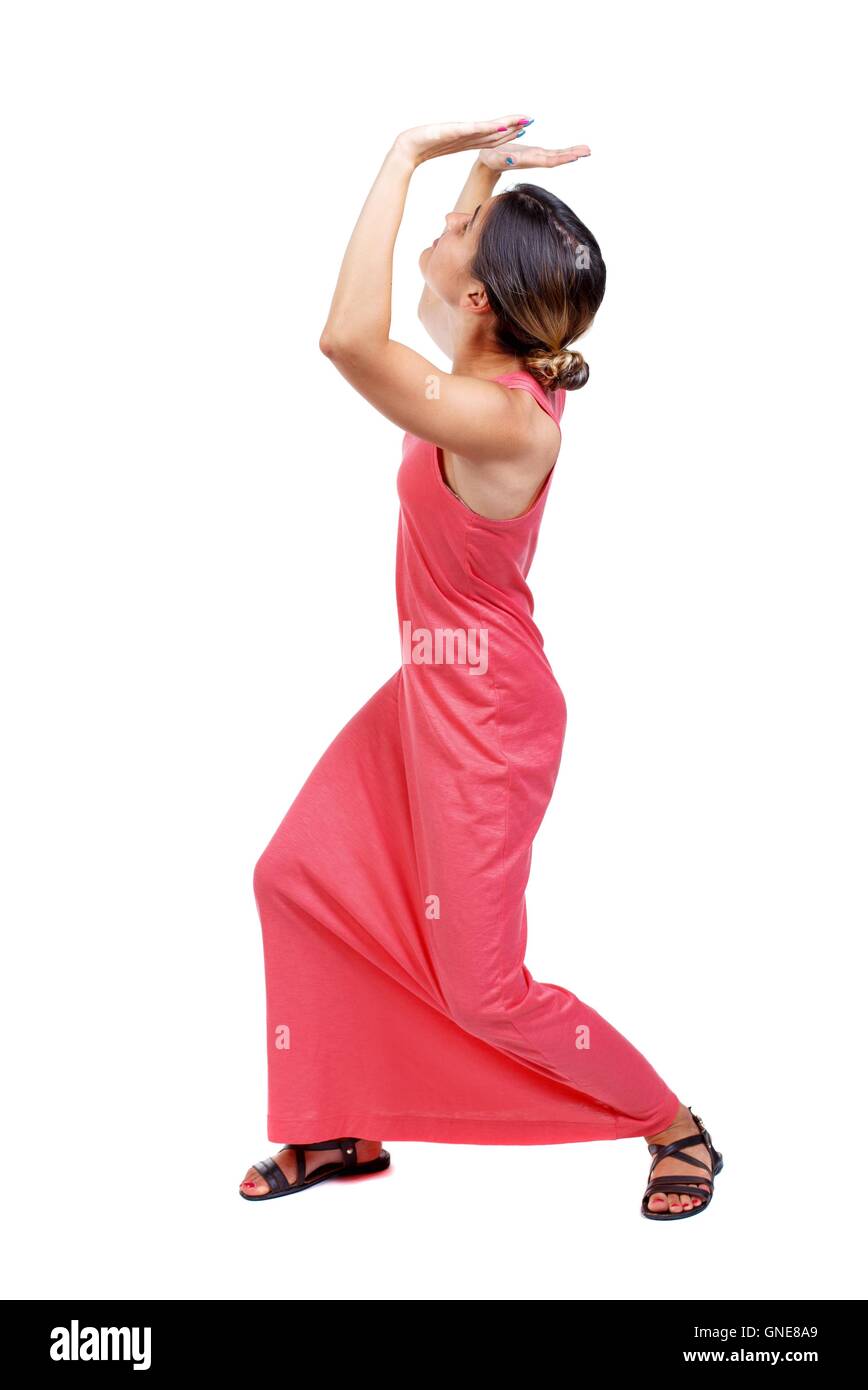 back view of woman protects hands from what is falling Stock Photo - Alamy
