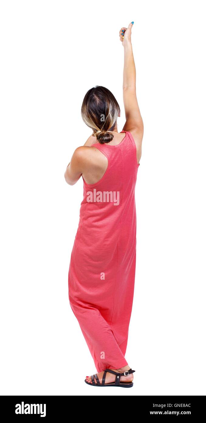 back view of standing girl pulling a rope from the top or cling Stock ...