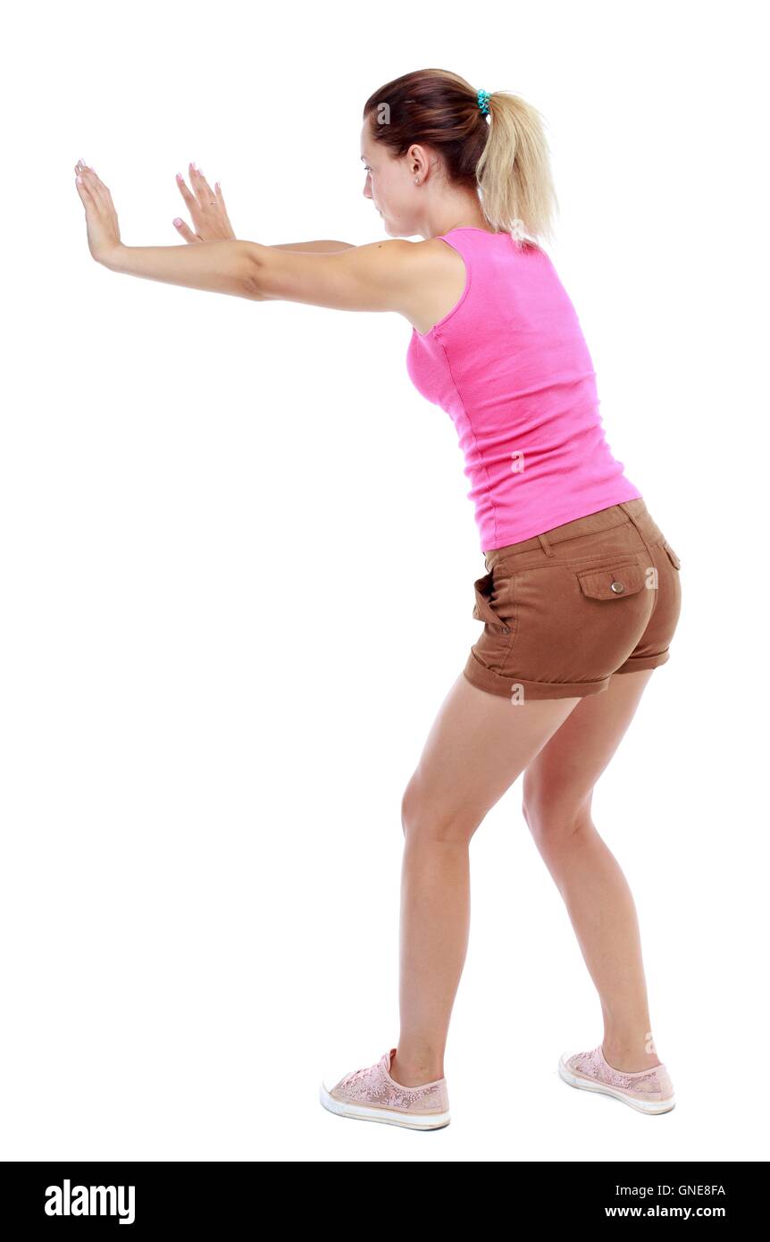 back view of woman pushes wall Stock Photo - Alamy