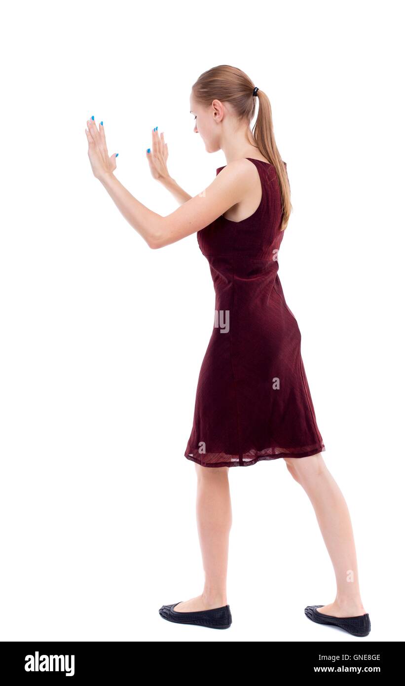 back view of woman pushes wall Stock Photo - Alamy